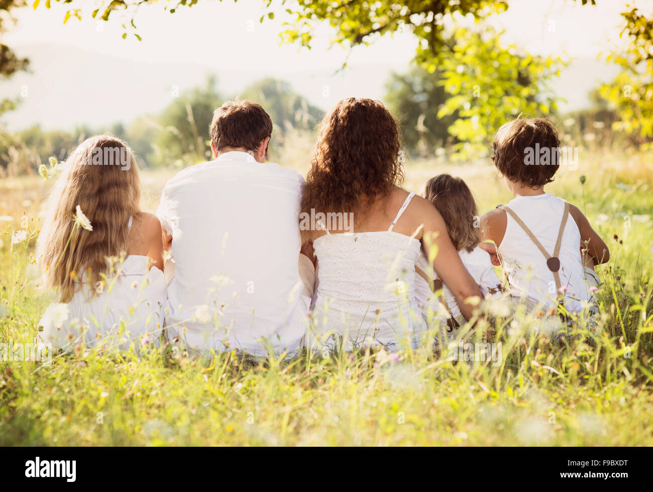 Happy young family spending time outdoor on a summer day Stock Photo ...