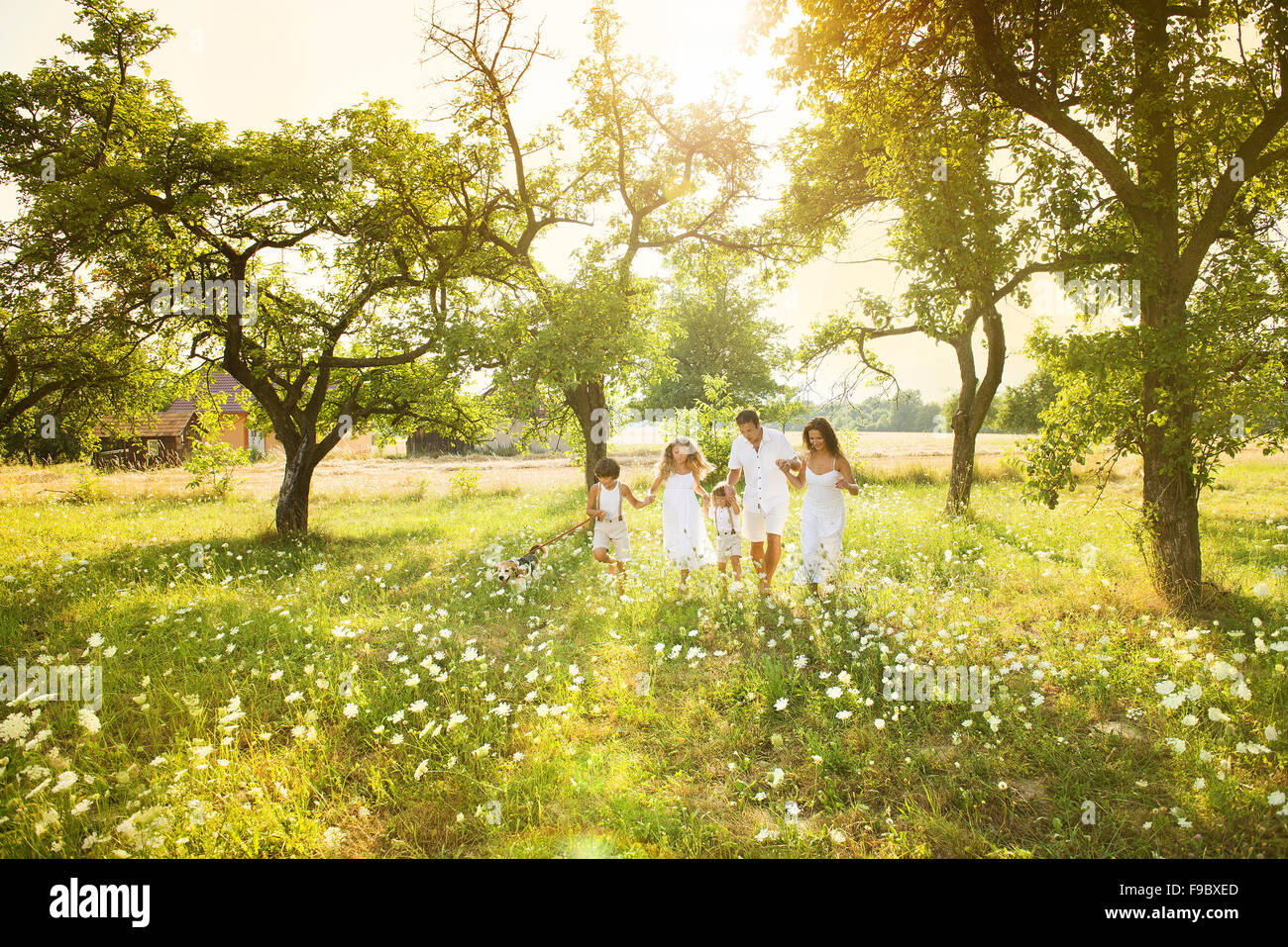 Happy young family spending time outdoor on a summer day Stock Photo ...