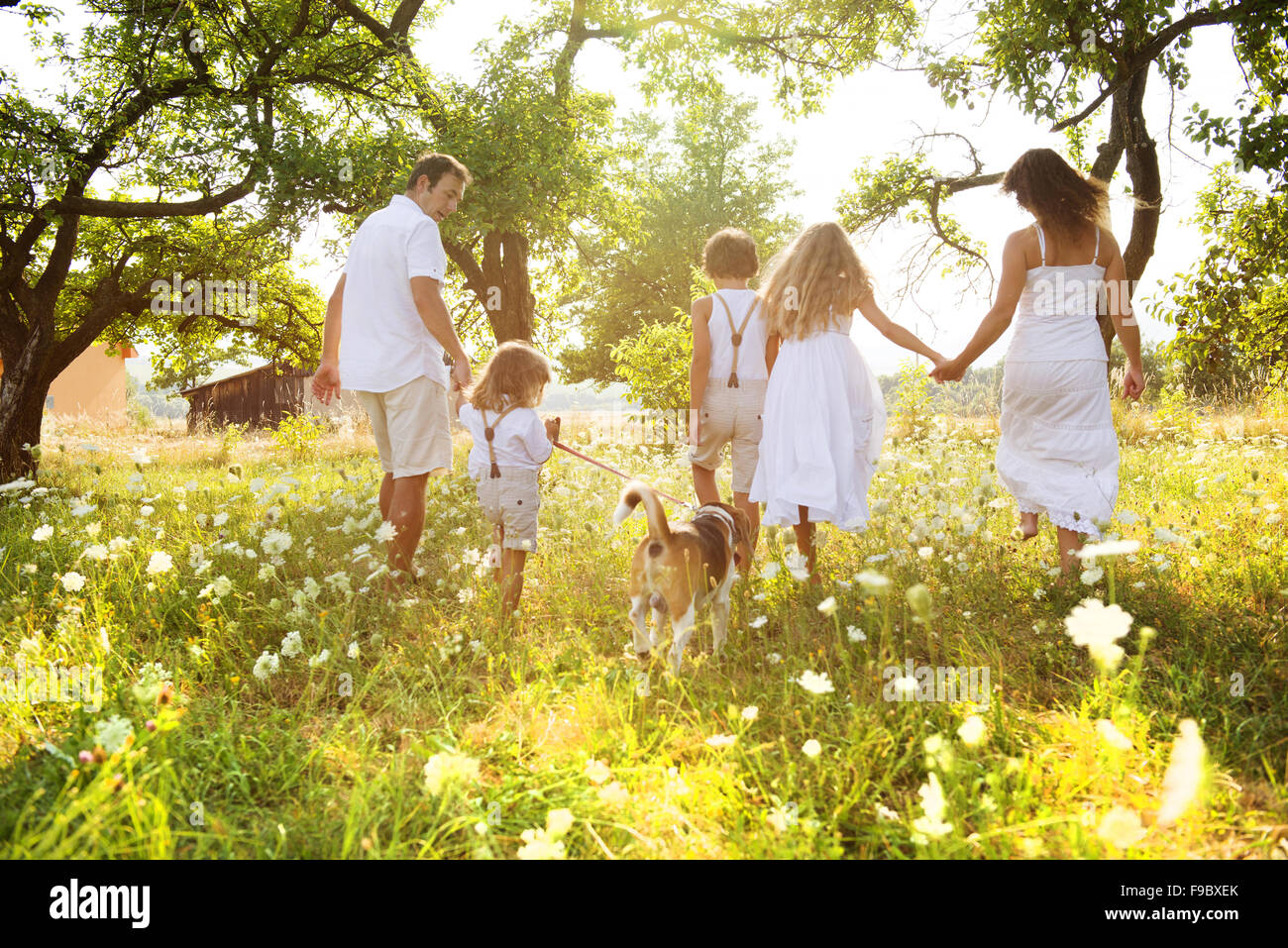 Happy young family spending time outdoor on a summer day Stock Photo ...