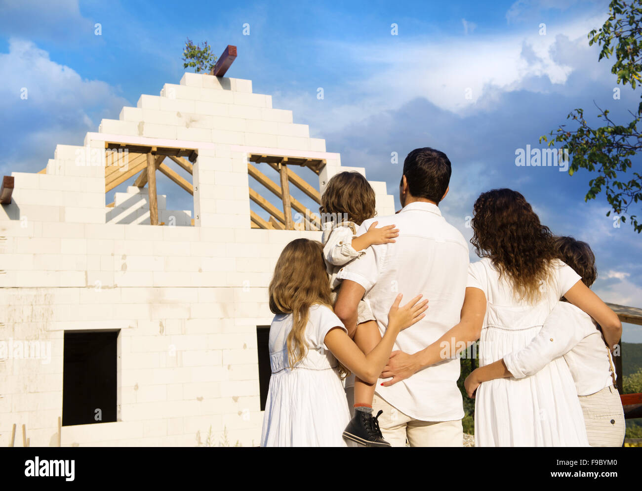 Happy and big family builds a new house for living Stock Photo - Alamy