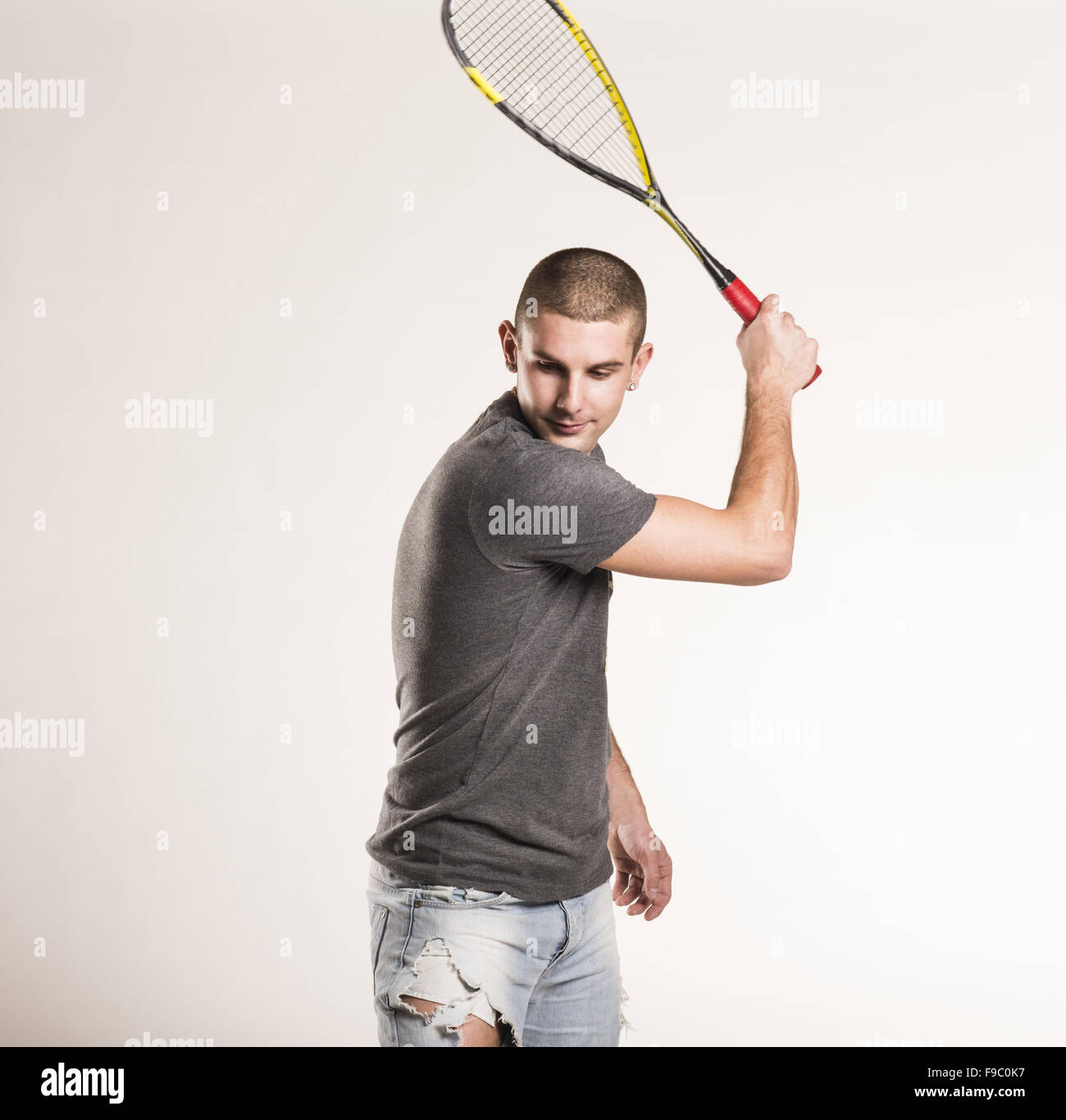 Squash player with racquet isolated on white background Stock Photo - Alamy