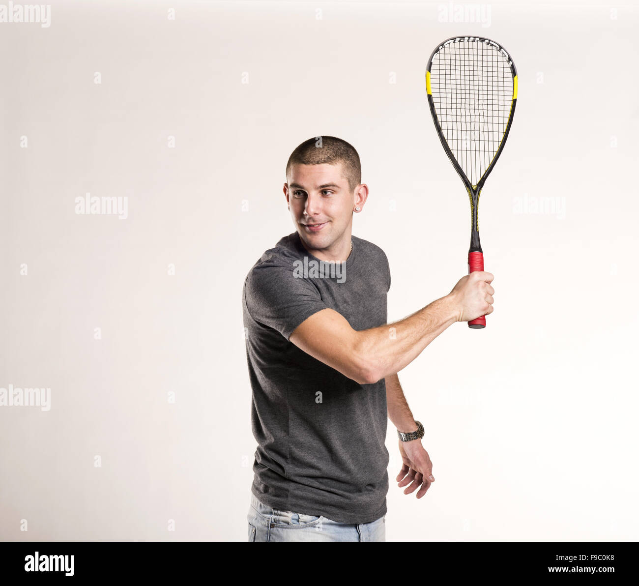 Squash player with racquet isolated on white background Stock Photo - Alamy