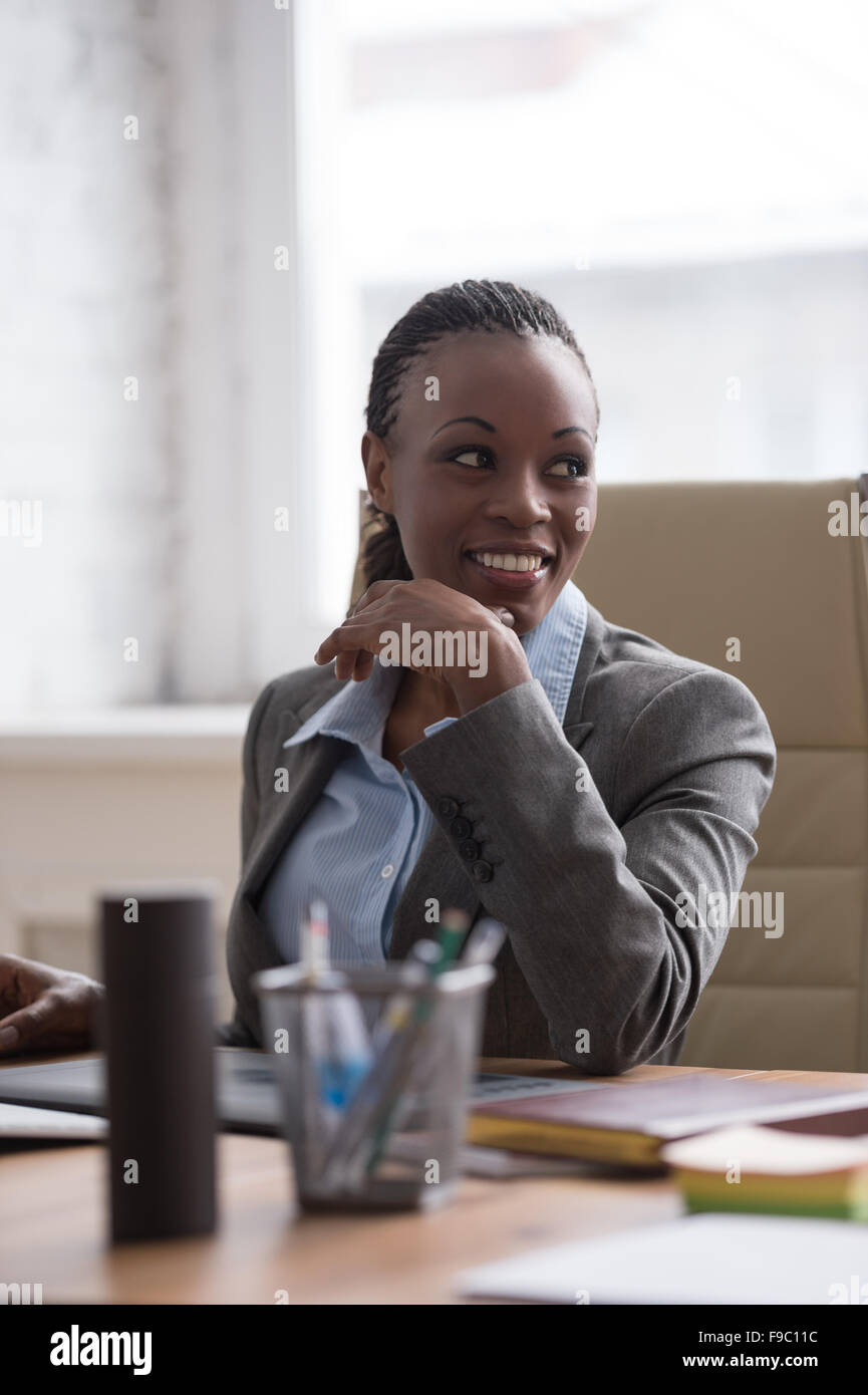 African pretty business woman working at pc in office Stock Photo - Alamy