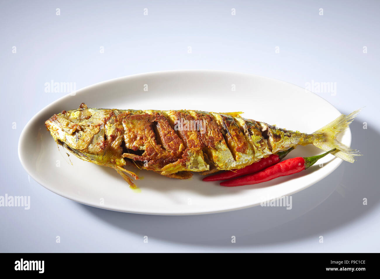 deep fried of fish marinated with turmeric powder Stock Photo - Alamy