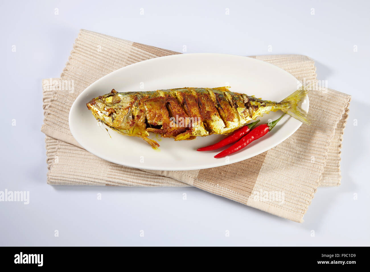 deep fried of fish marinated with turmeric powder Stock Photo - Alamy