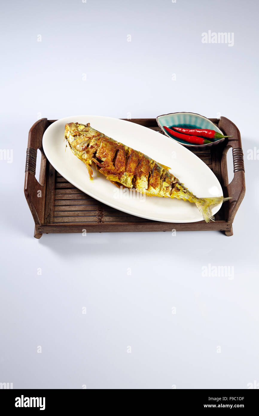 deep fried of fish marinated with turmeric powder Stock Photo - Alamy