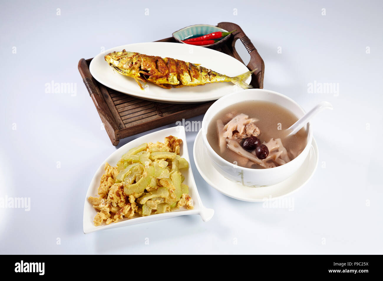 turmeric fish,stir fried bitter gourd and lotus root soup Stock Photo ...