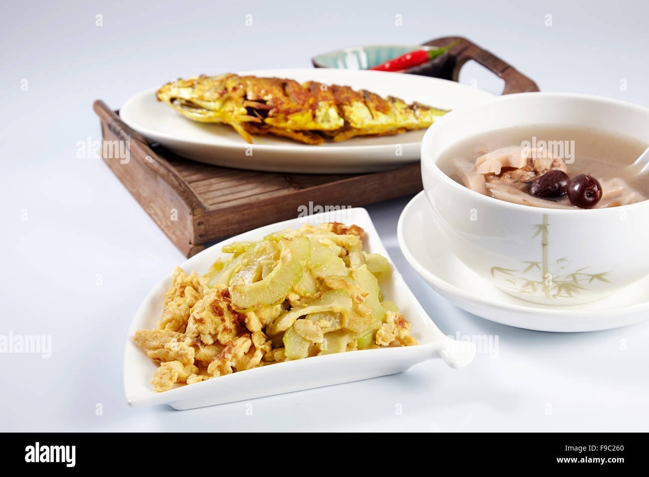 turmeric fish,stir fried bitter gourd and lotus root soup Stock Photo ...