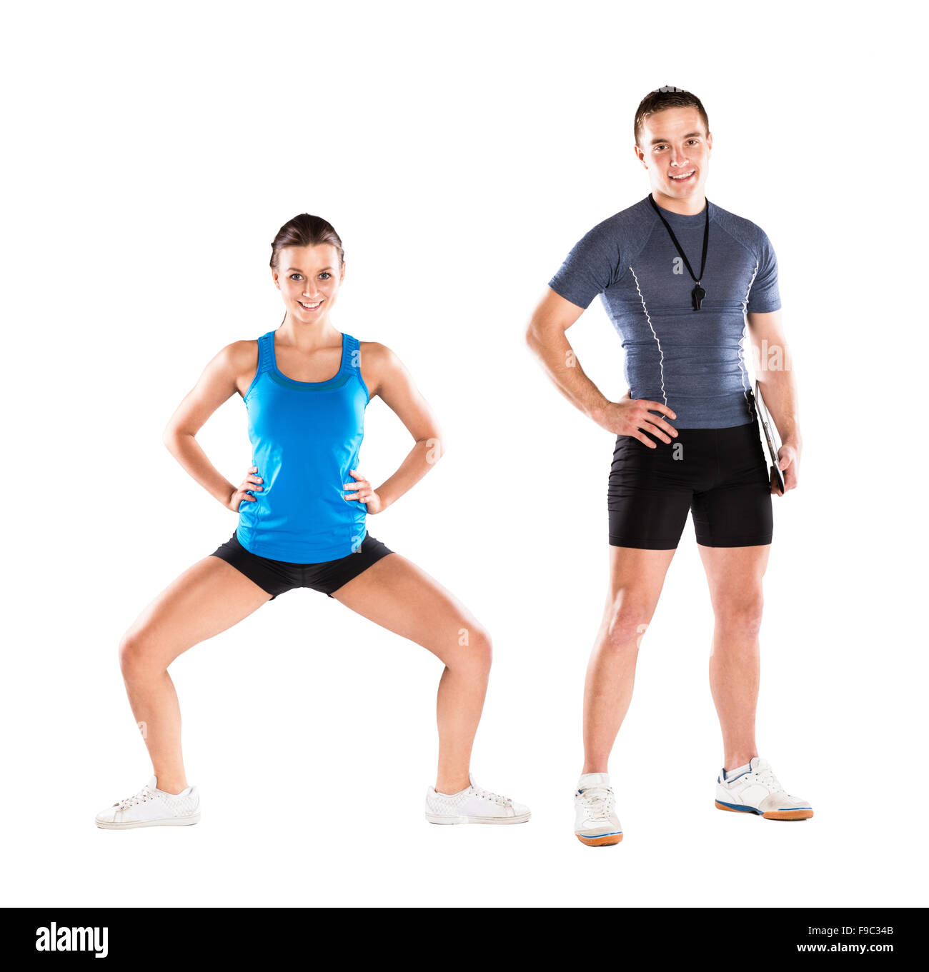 Professional fitness coach with beautiful young woman on white ...
