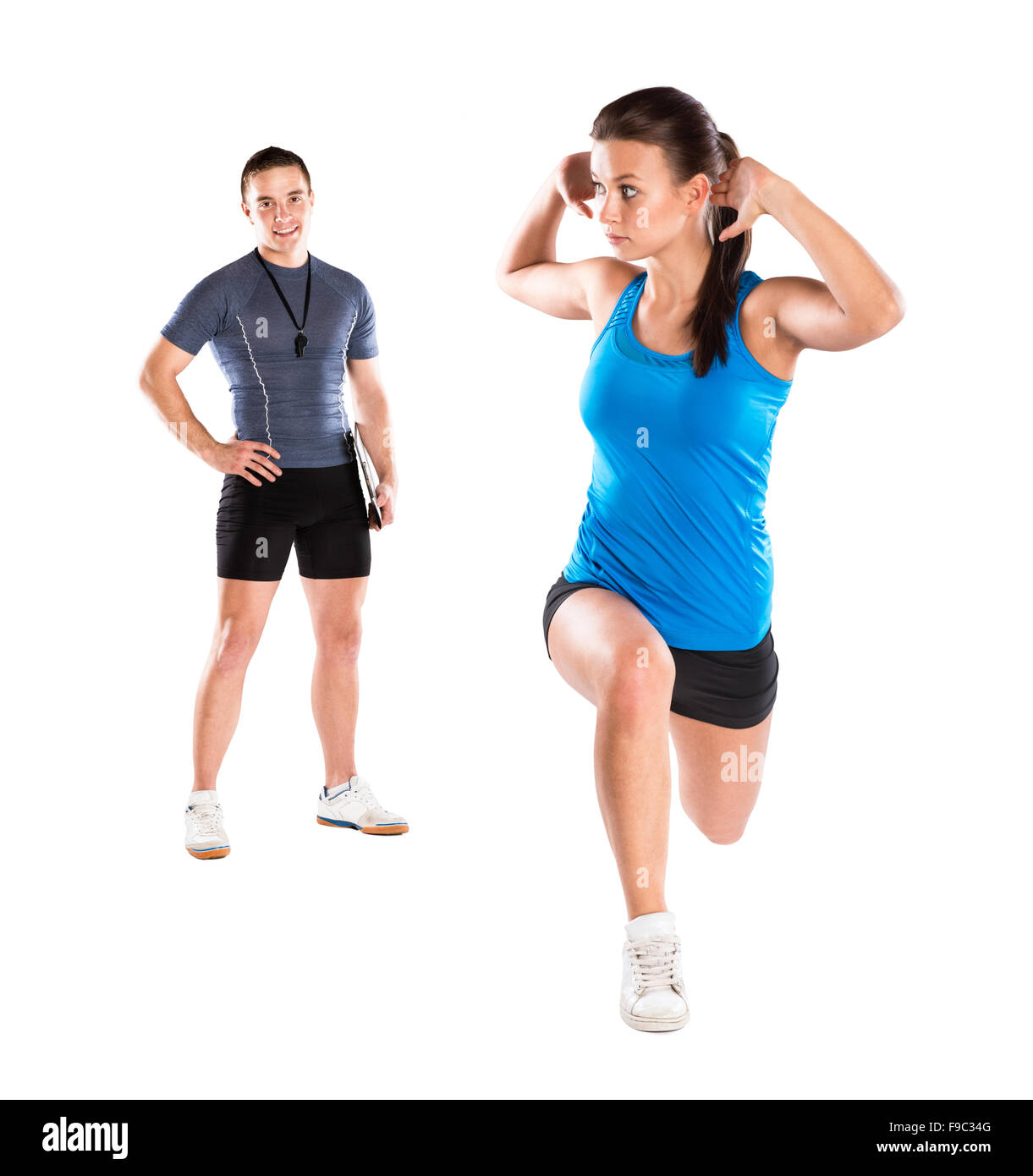 Professional fitness coach with beautiful young woman on white ...
