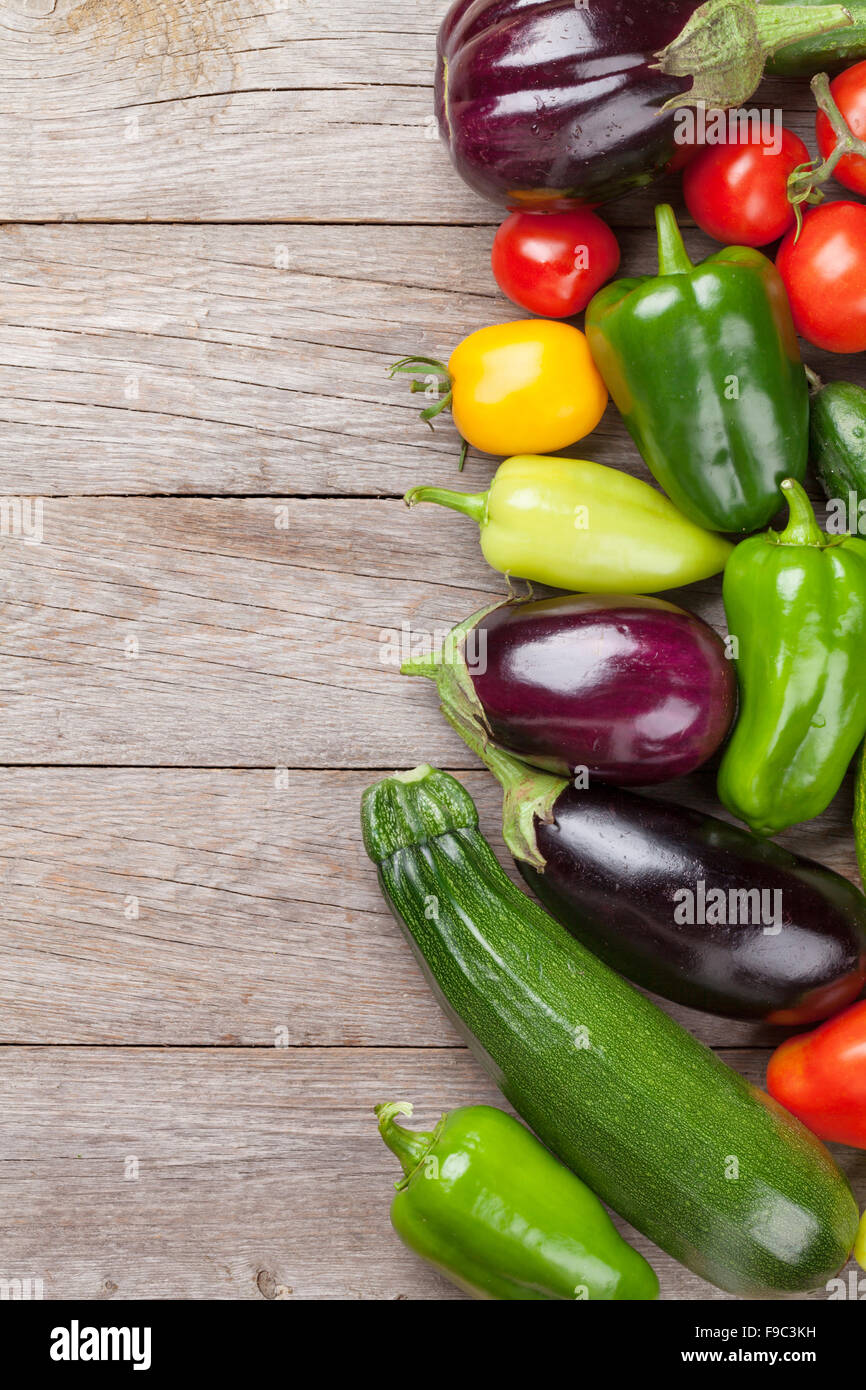 Fresh farmers garden vegetables on wooden table. Top view with copy ...