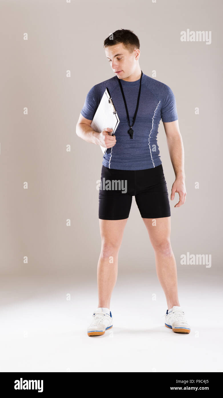 Young professional fitness coach standing in studio Stock Photo - Alamy