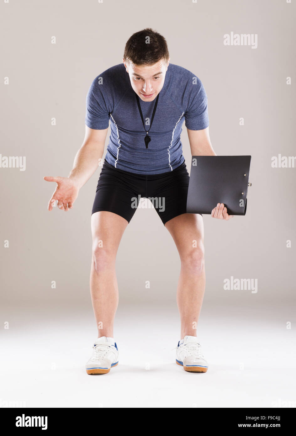Young professional fitness coach standing in studio Stock Photo - Alamy