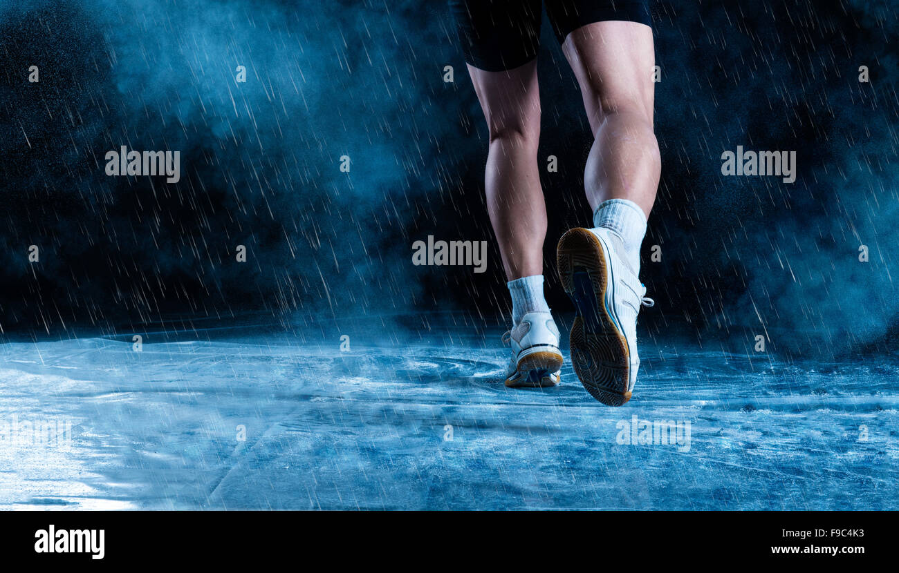 Detail of runne feet running in misty dark Stock Photo - Alamy