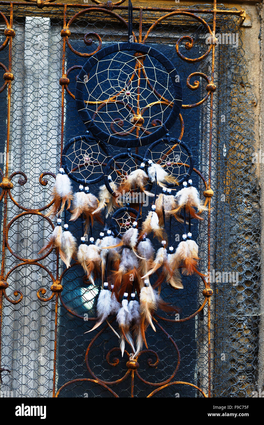 Dream Catcher and ornamental window on background. Rust structure on ...