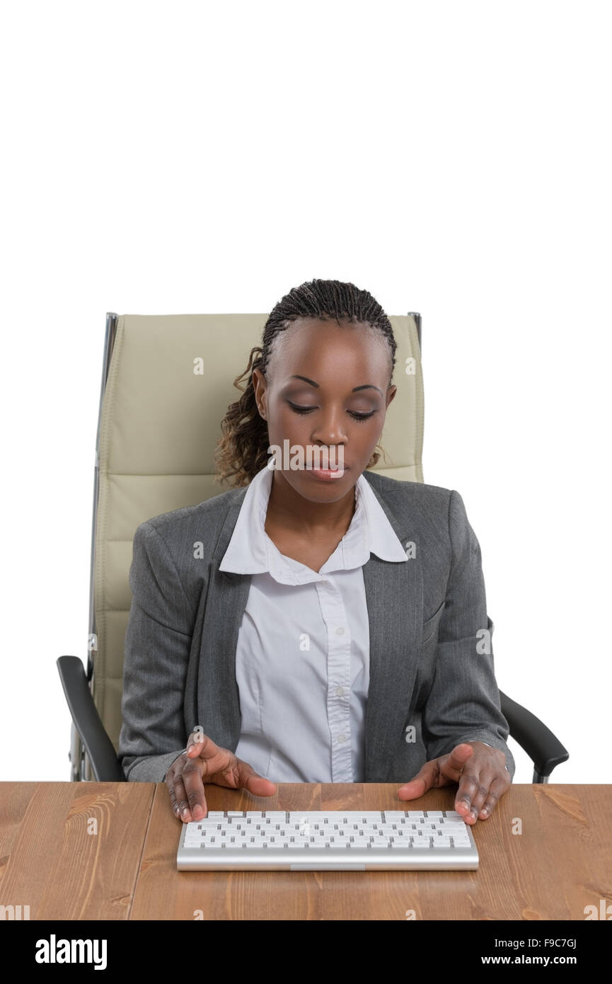 African business woman sitting at her desk and working isolated on ...