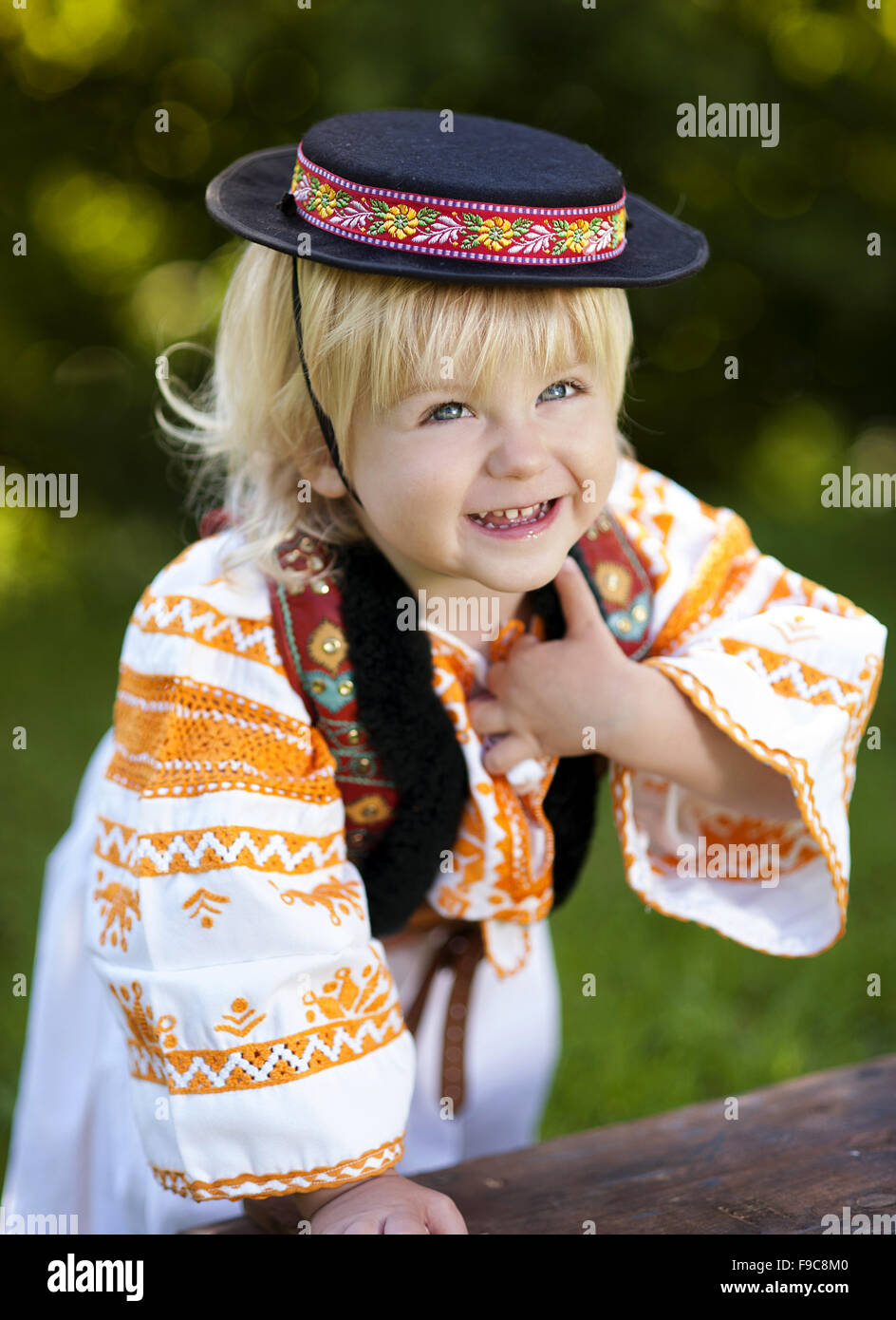 Cute child in folk costume from Easten Europe Stock Photo - Alamy