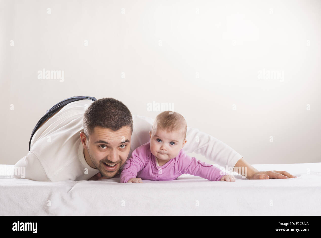 Young father is having fun with his little baby Stock Photo - Alamy