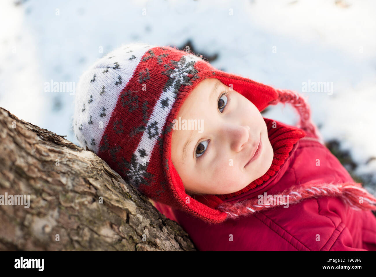 Little girl is playing outside in cold winter Stock Photo - Alamy