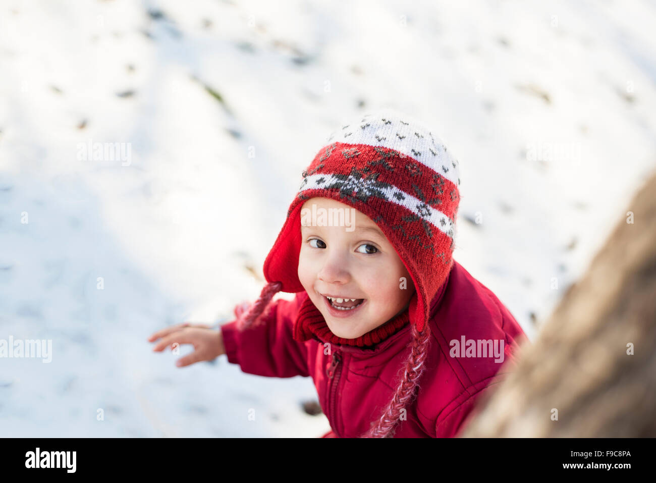 Little girl is playing outside in cold winter Stock Photo - Alamy