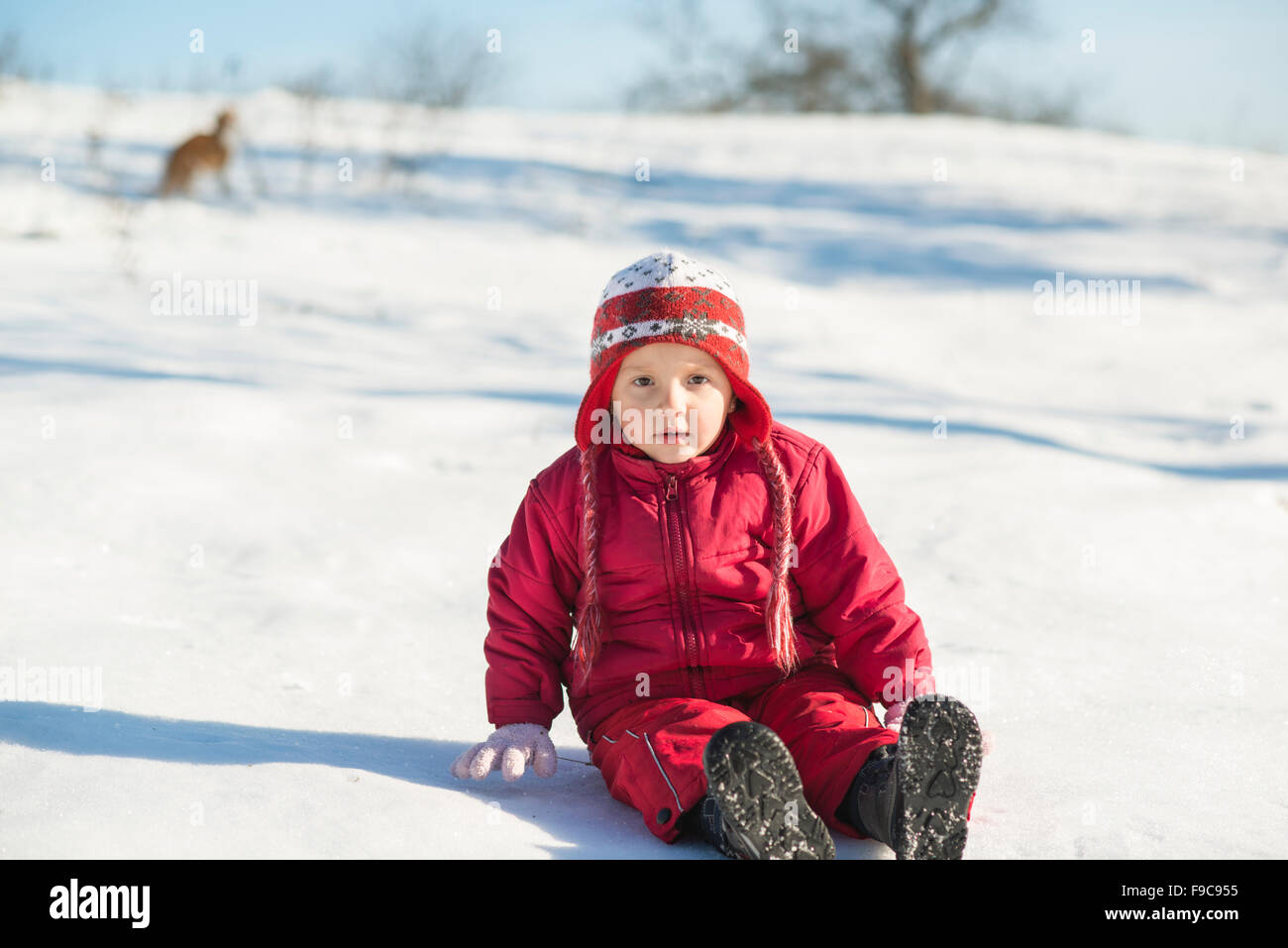 Little girl is playing outside in cold winter Stock Photo - Alamy