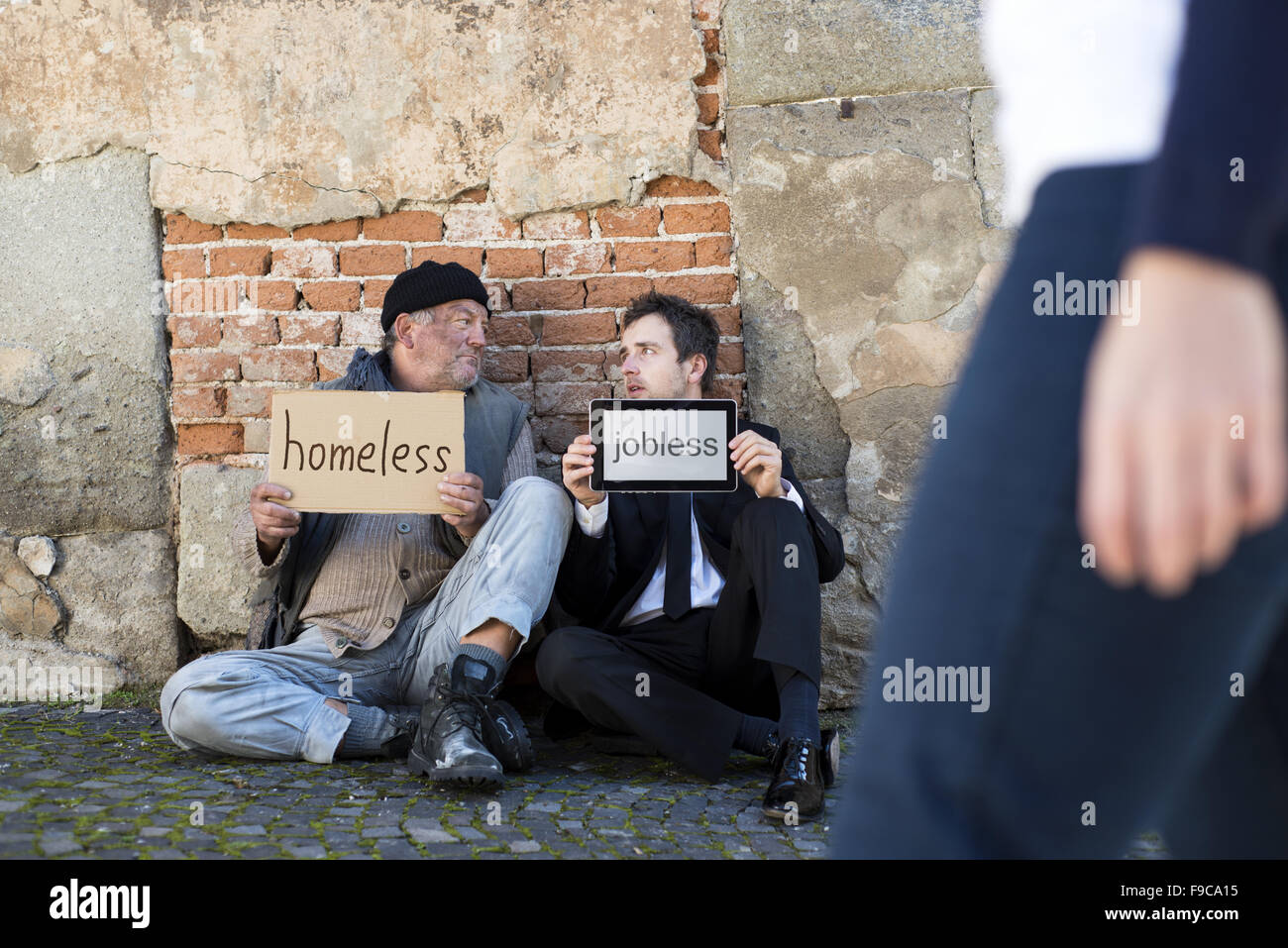 homeless men are begging on the street Stock Photo - Alamy