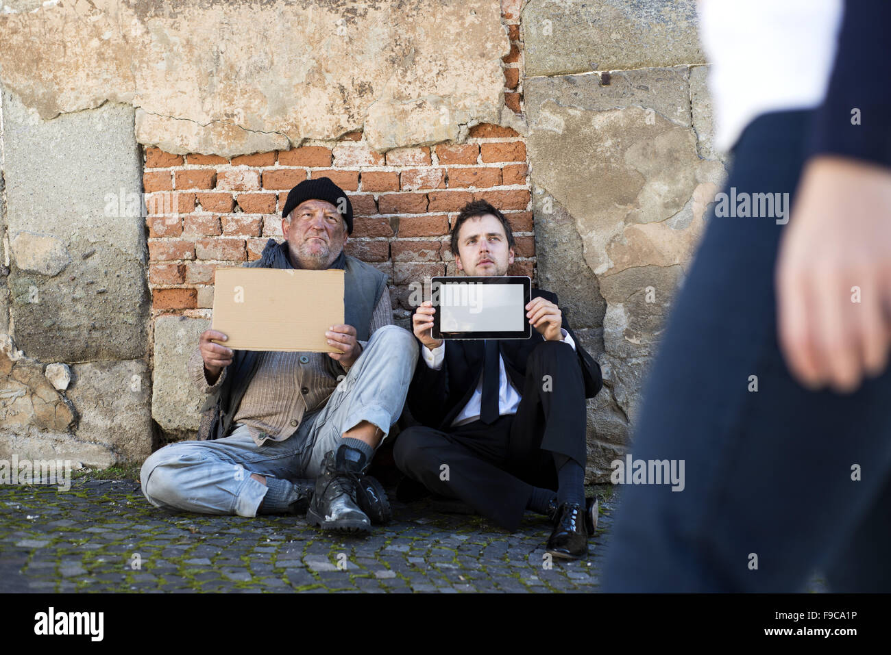 homeless men are begging on the street Stock Photo - Alamy