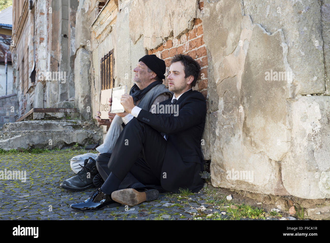 homeless men are begging on the street Stock Photo - Alamy