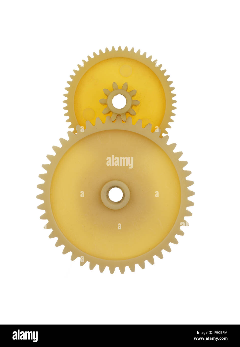 two plastic gears yellow isolated on a white background Stock Photo - Alamy