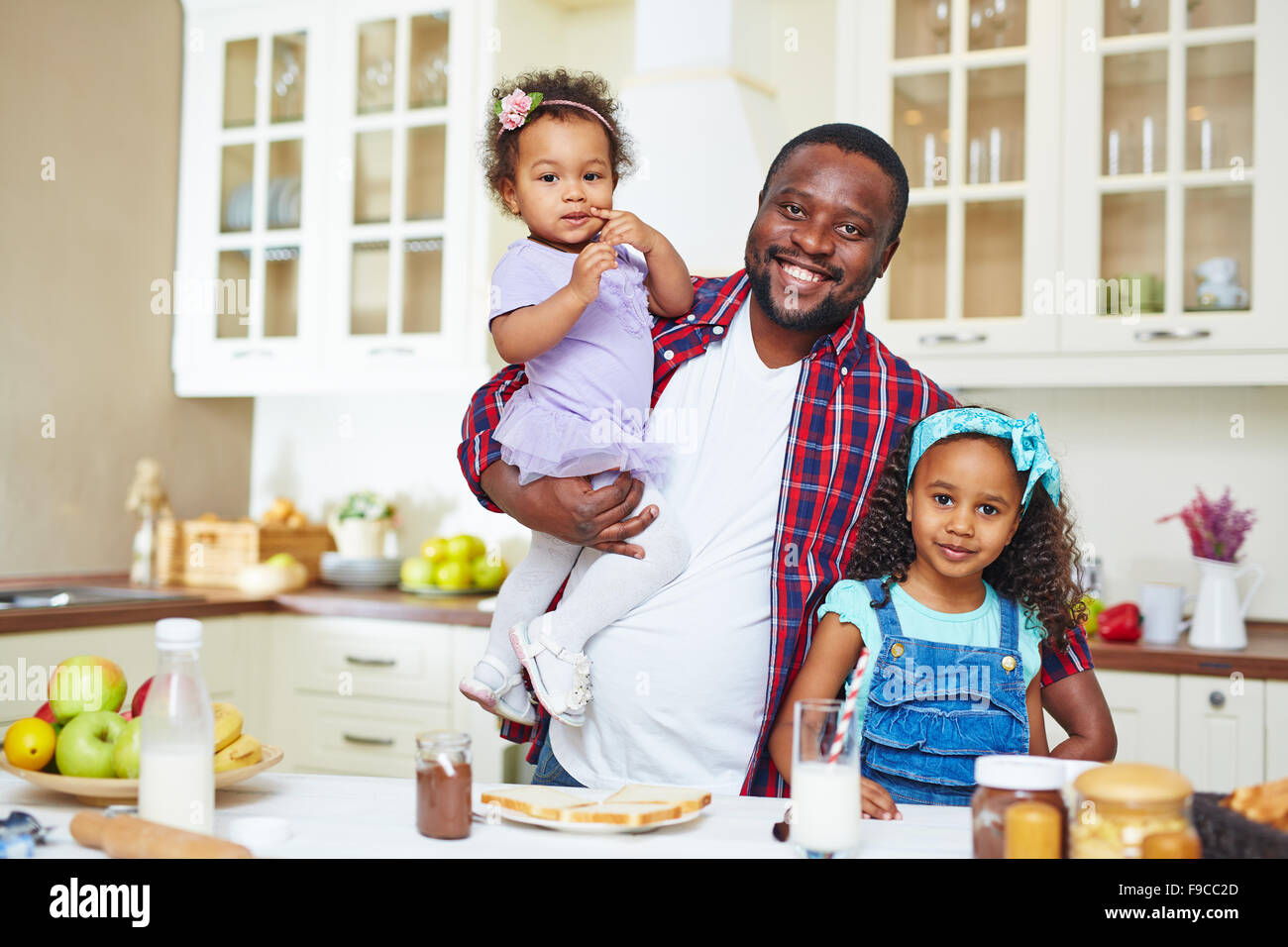 Happy African-American family having breakfast Stock Photo - Alamy