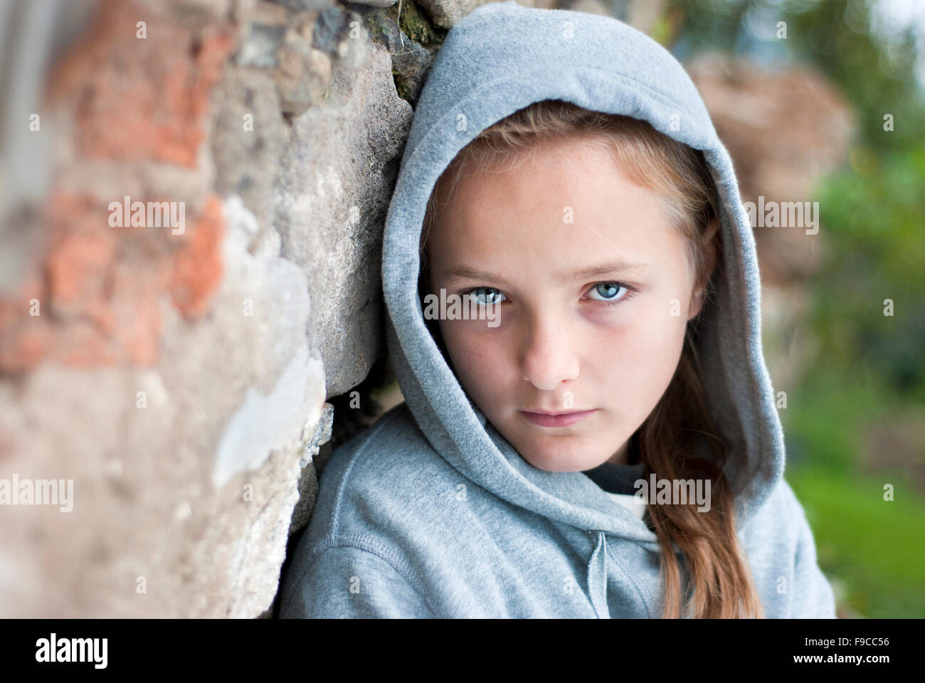 Little sad child with hoody Stock Photo - Alamy