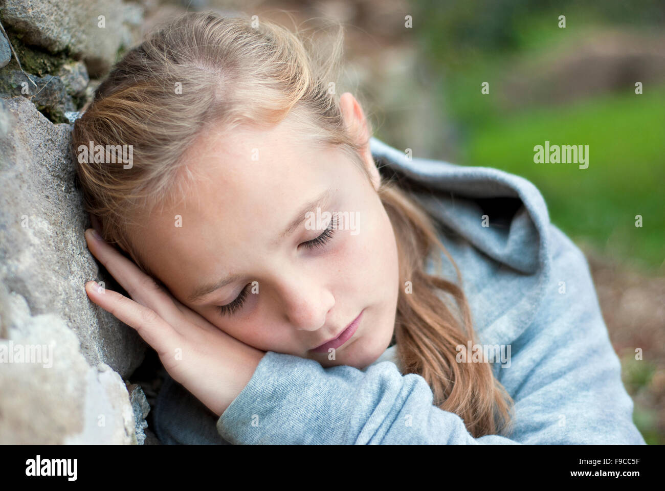 Little sad child is lonesome Stock Photo - Alamy