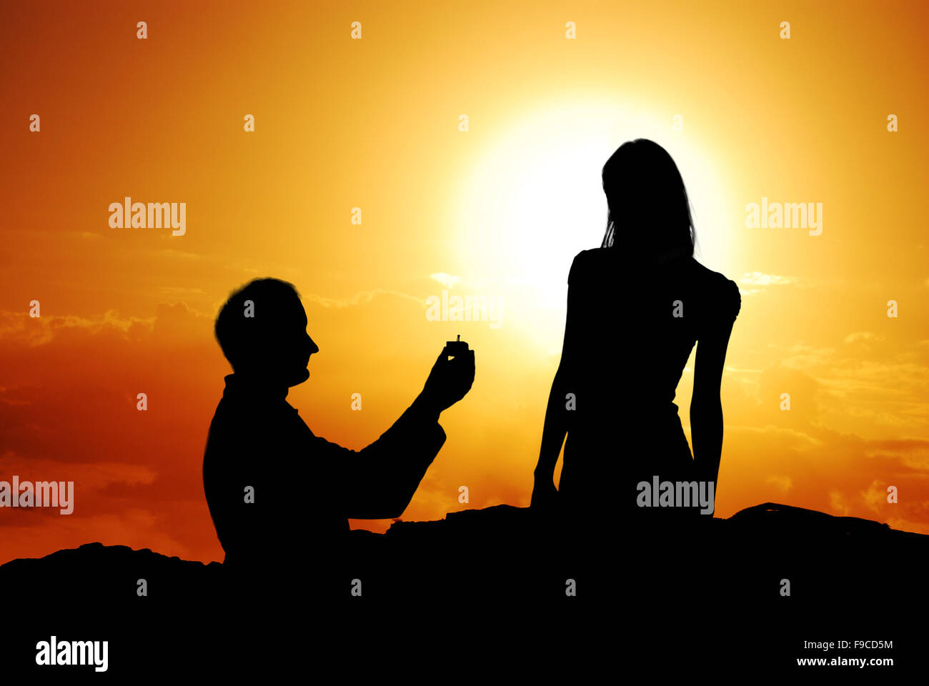 Romantic proposal scene with happy woman and man Stock Photo - Alamy