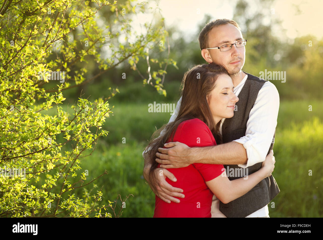 Happy couple is having romantic time in nature Stock Photo - Alamy