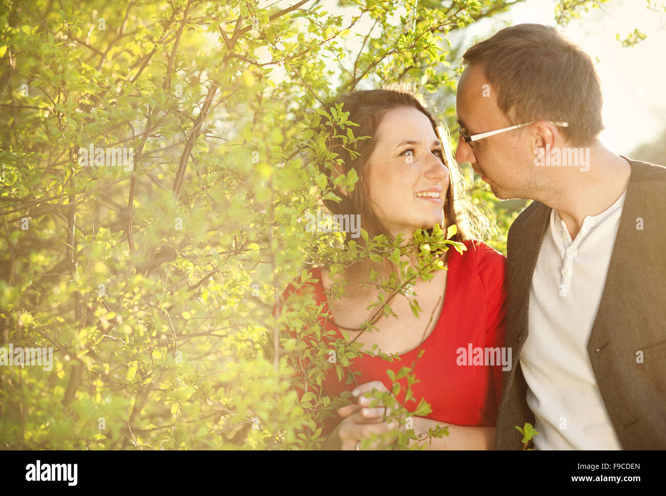 Happy couple is having romantic time in nature Stock Photo - Alamy