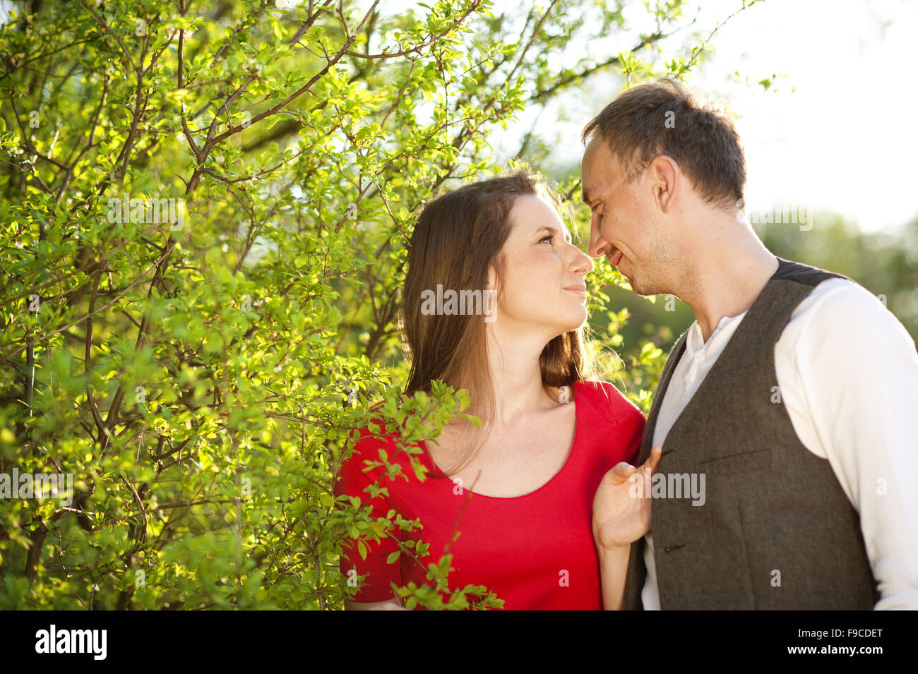 Happy couple is having romantic time in nature Stock Photo - Alamy