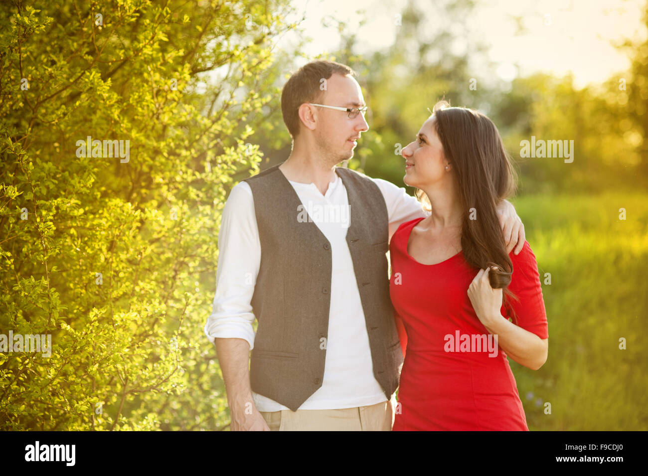 Happy couple is having romantic time in nature Stock Photo - Alamy