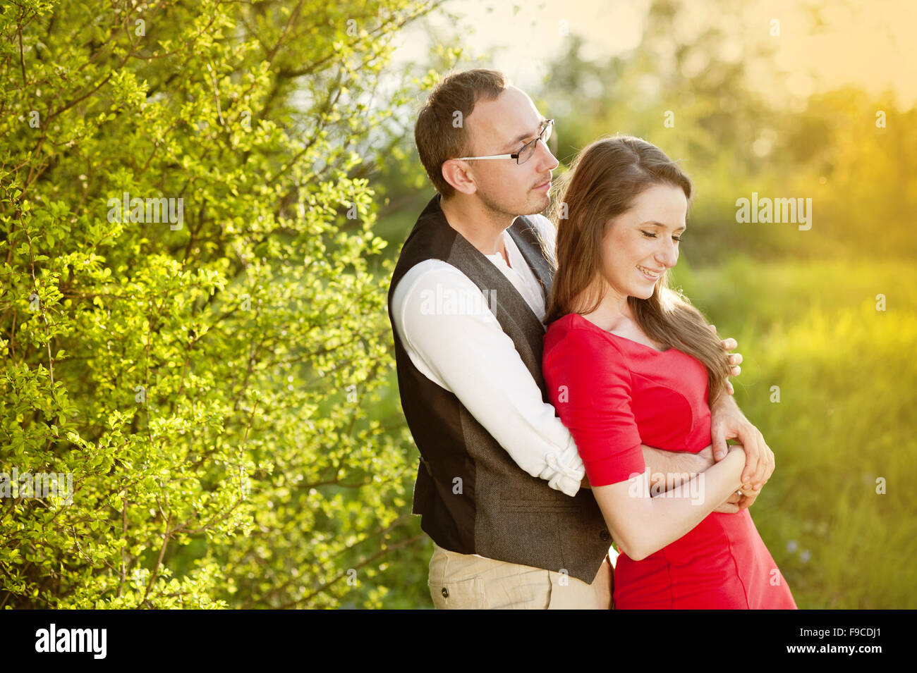 Happy couple is having romantic time in nature Stock Photo - Alamy