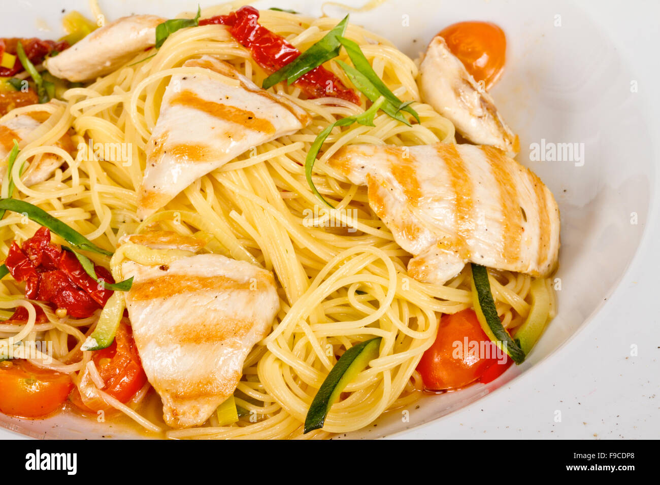 close-up of plate of pasta and chicken Stock Photo - Alamy