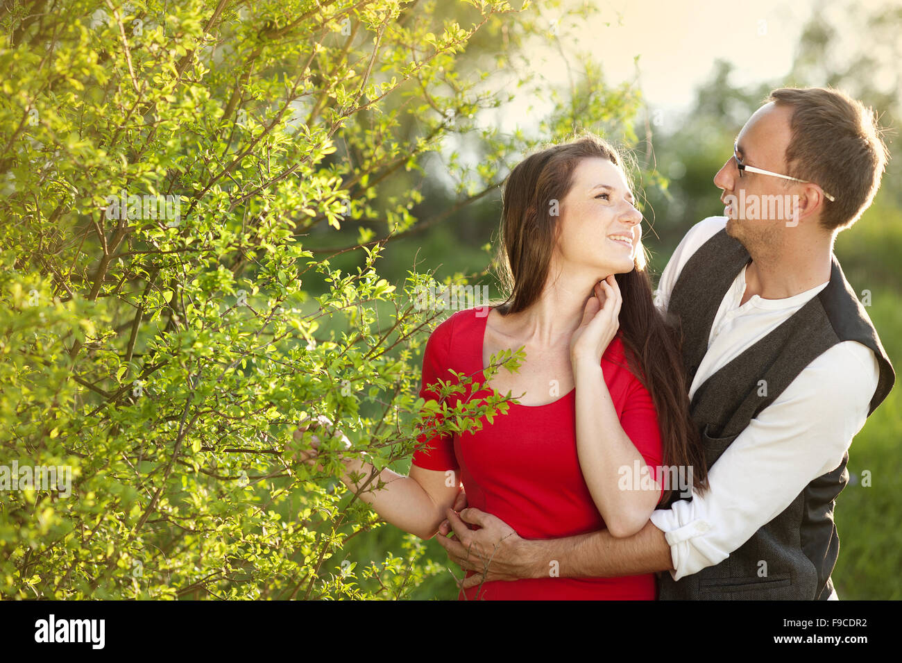 Happy couple is having romantic time in nature Stock Photo - Alamy