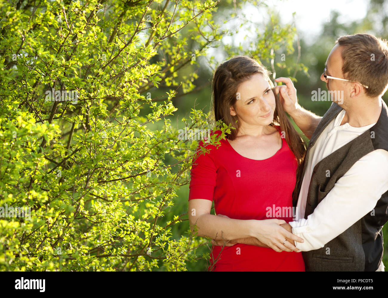 Happy couple is having romantic time in nature Stock Photo - Alamy