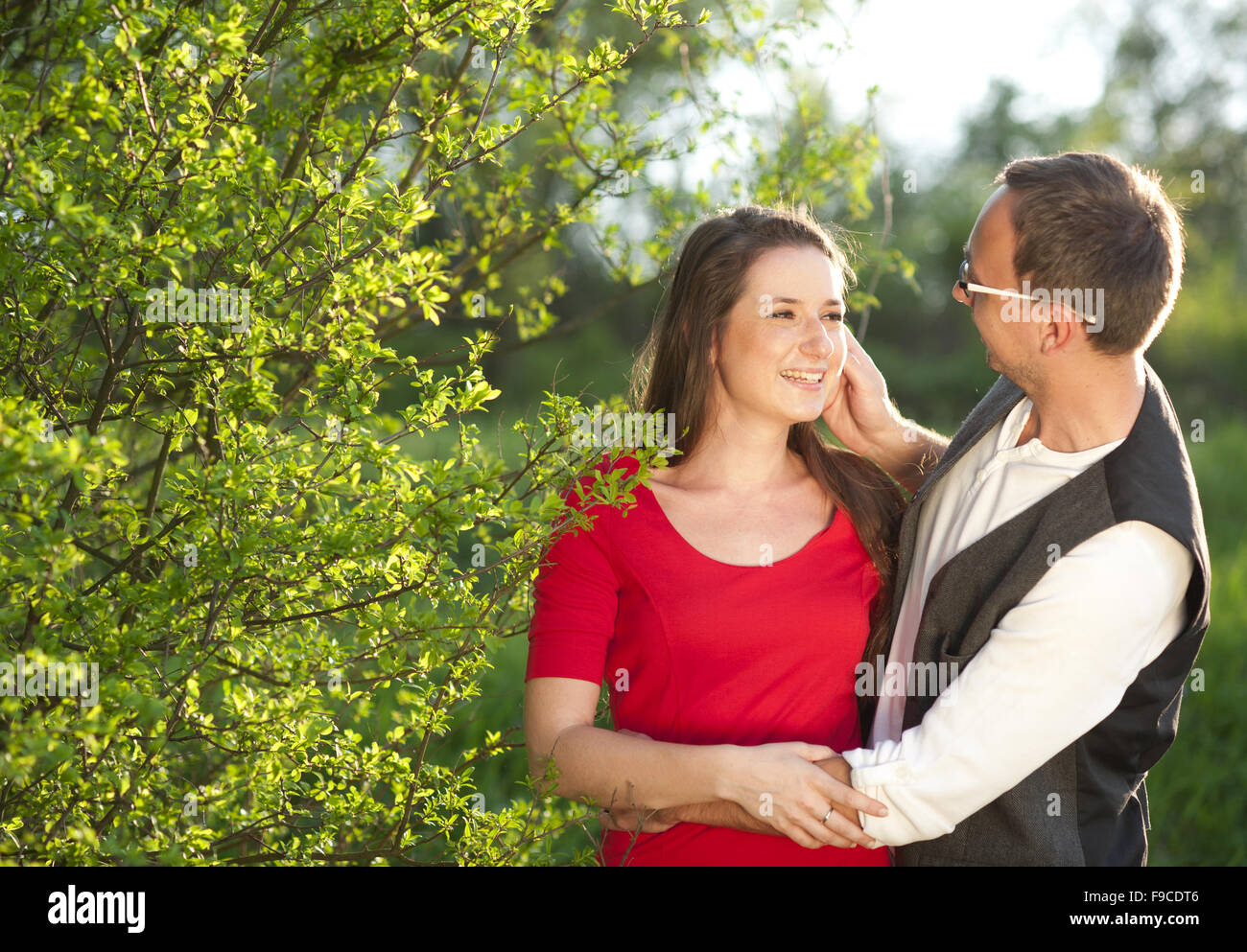 Happy couple is having romantic time in nature Stock Photo - Alamy