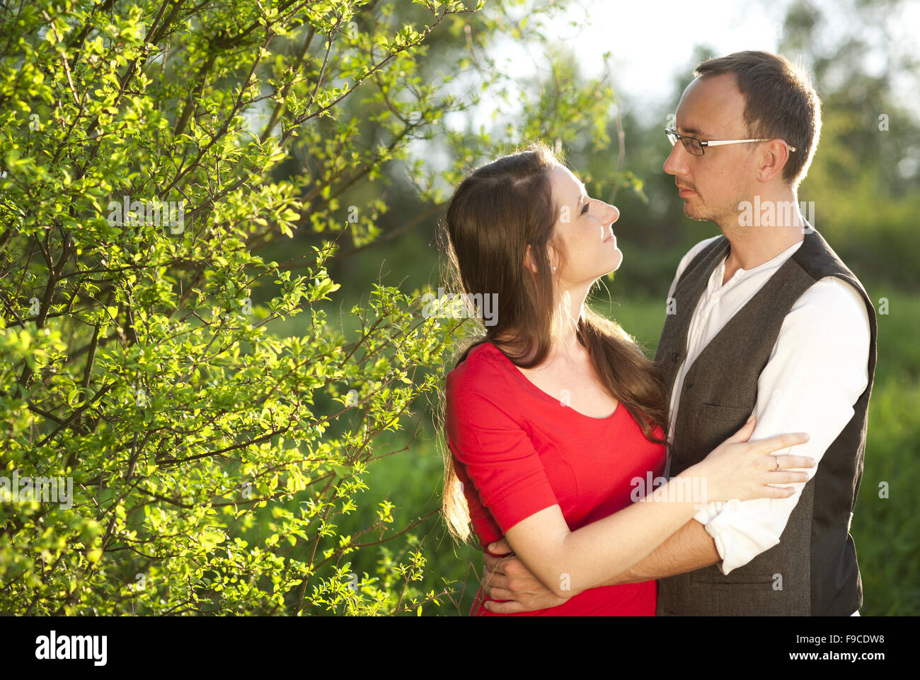 Happy couple is having romantic time in nature Stock Photo - Alamy