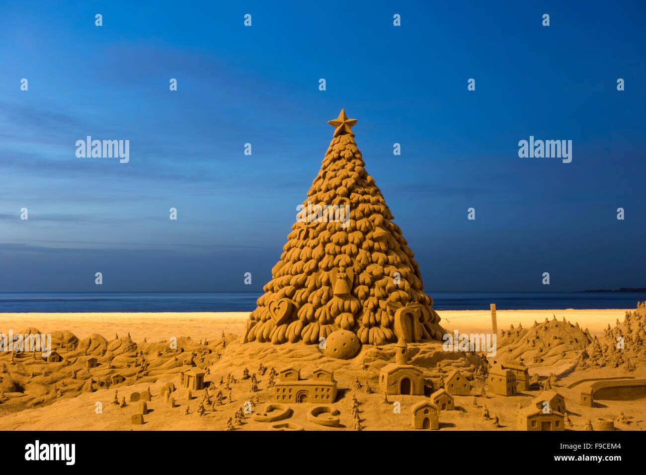 Christmas tree, nativity scene sand sculpture on beach in Spain Stock ...