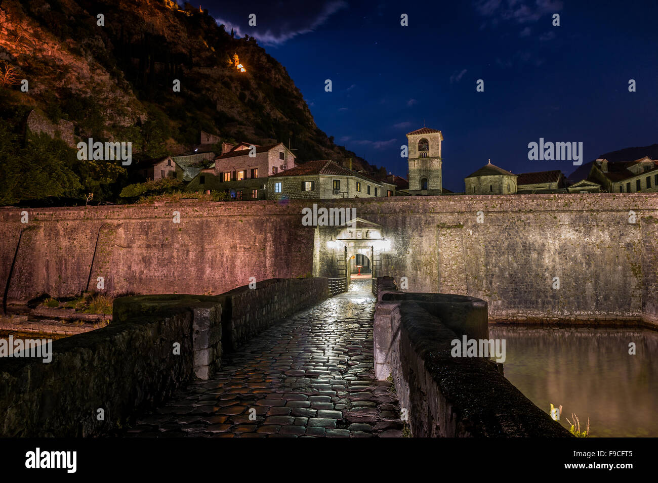 Gate to Kotor ancient fortress at night Stock Photo - Alamy