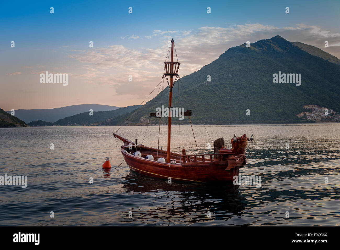 Vintage style small pirate's ship at anchor Stock Photo - Alamy