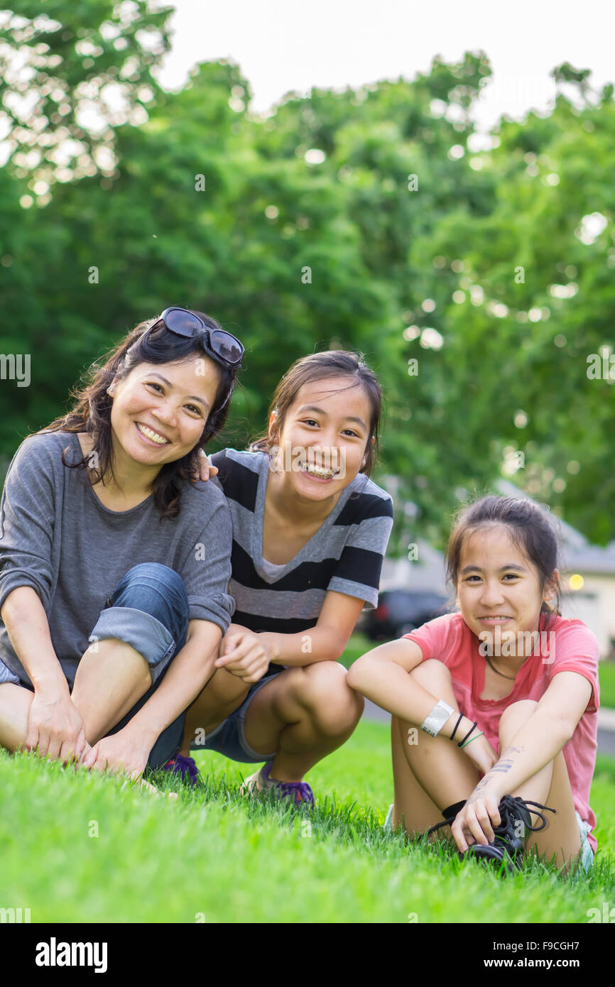 Smiling chinese mother pointing hi-res stock photography and images - Alamy