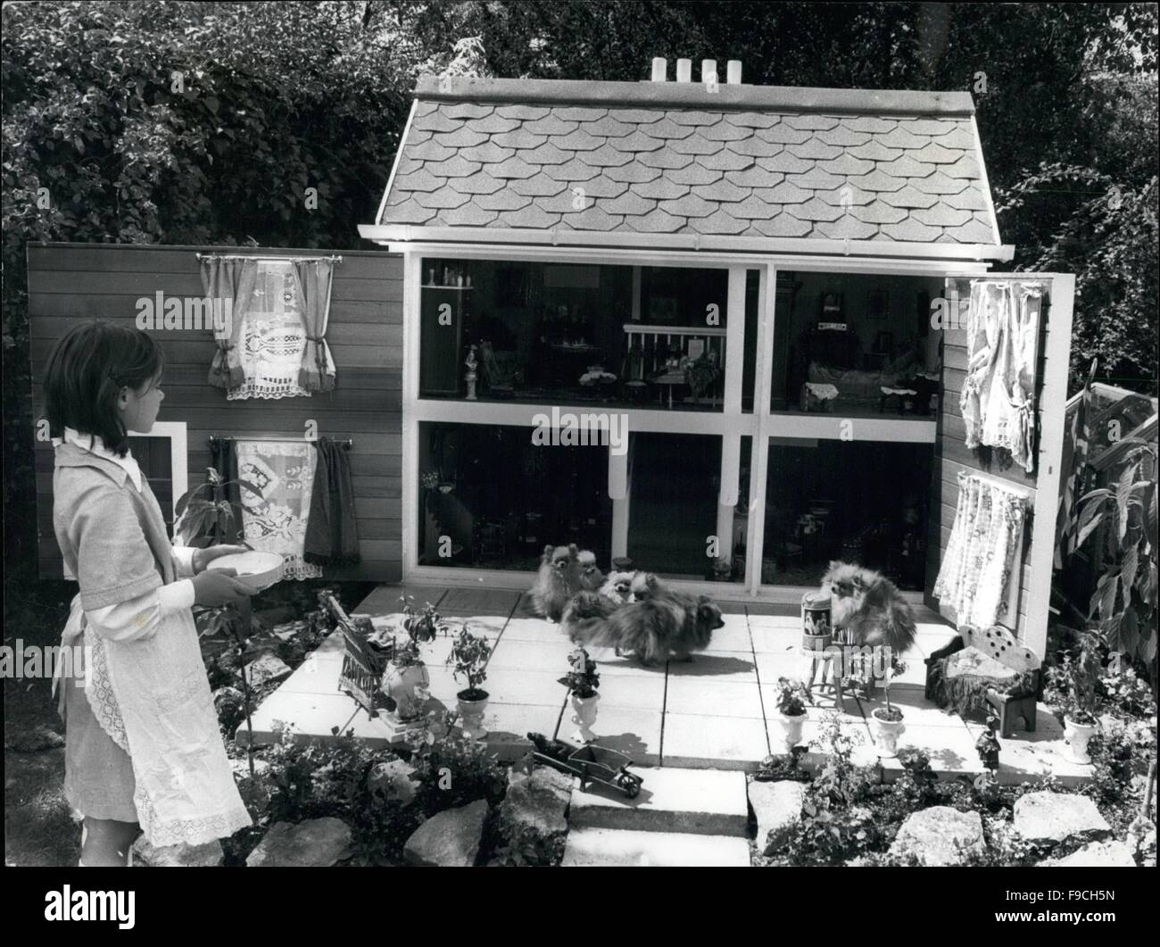 1964 - 9 year old Natalie Hall, the Poms home help, plays with one her ...