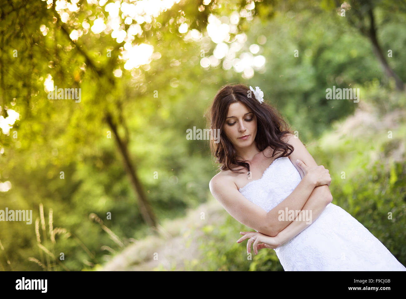 Portrait of beautiful bride in white wedding dress at the meadow Stock ...