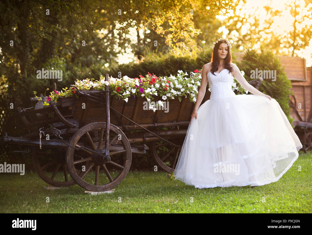 Beautiful bride in country style wedding dress Stock Photo - Alamy